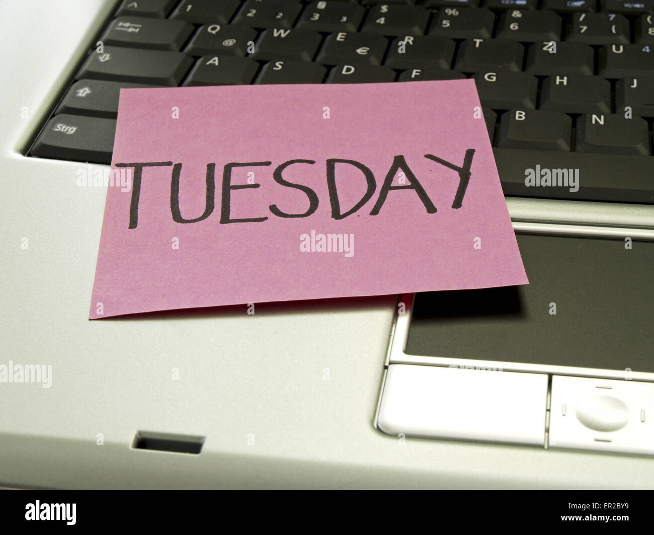Memo note on notebook, Tuesday Stock Photo - Alamy