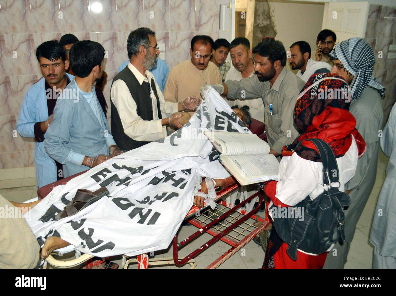 Paramedical staffs are busy in medical examination of dead body of a ...