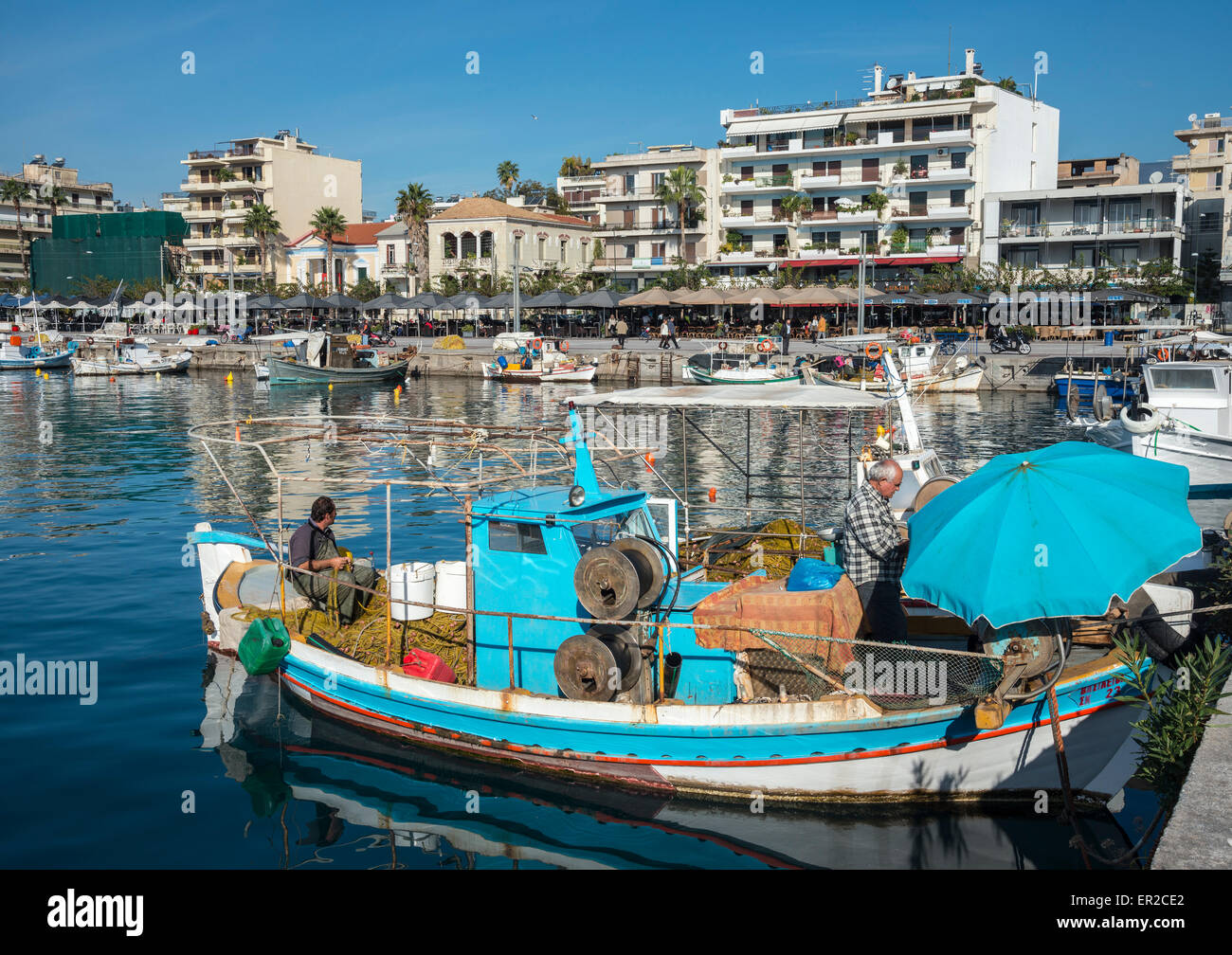 Fishermen and fishing boats in the harbour at Kalamata, Messinia ...