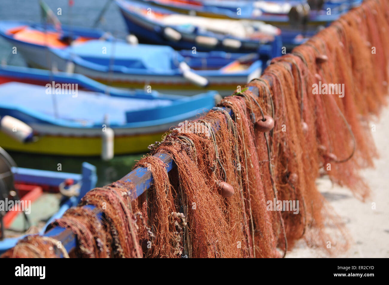 Fishing nets drying and blurred fishing boats on the background Stock ...
