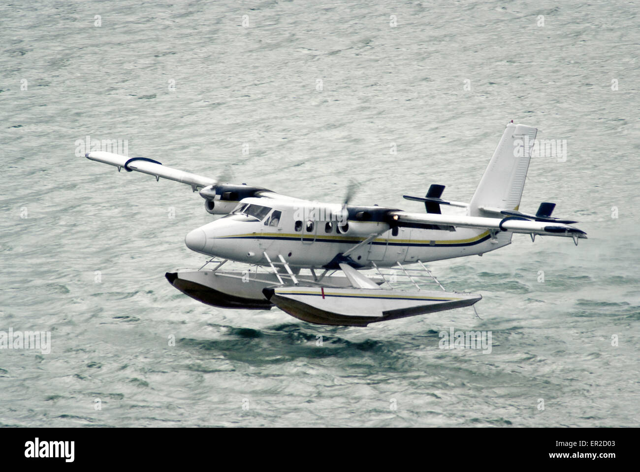 twin propeller engine hydroplane taking off from water surface Stock ...