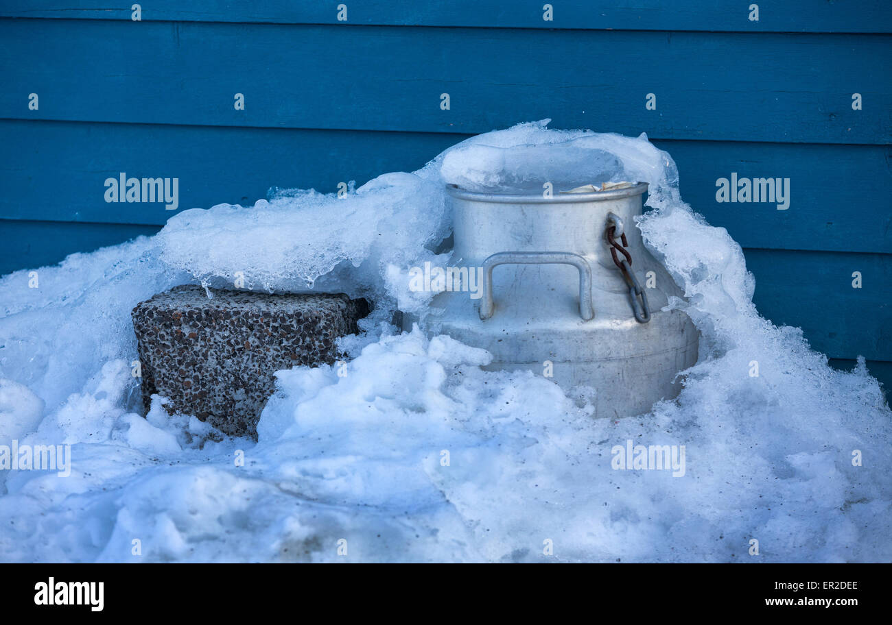 A metal jug stuck in the snow is pictured in front of Koldewey Station ...