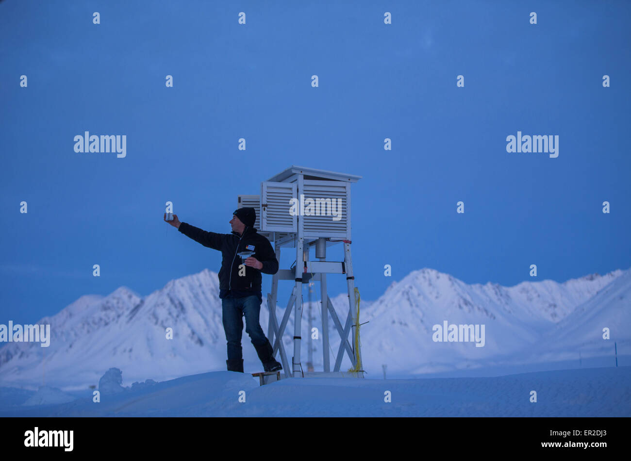 Technician Juergen Graeser of the atmospheric observatory of AWIPEV ...
