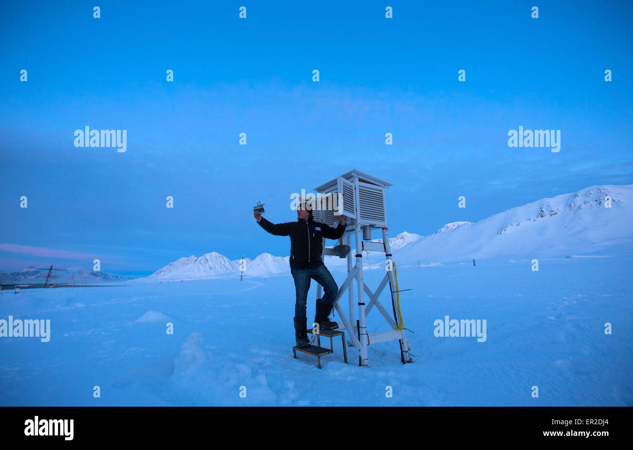 Technician Juergen Graeser of the atmospheric observatory of AWIPEV ...