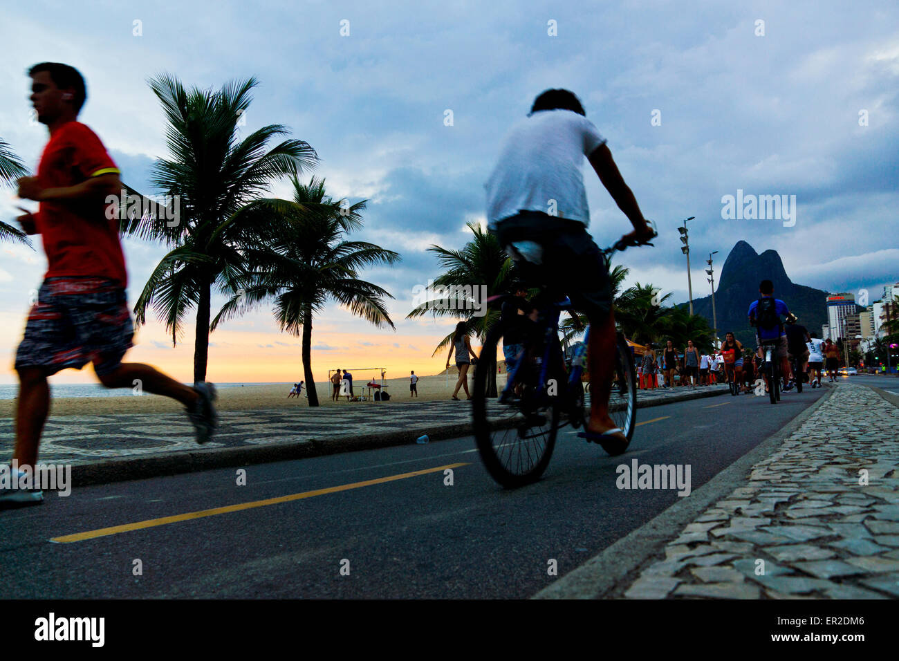 biker and jogger in Rio - Ipanema Stock Photo - Alamy