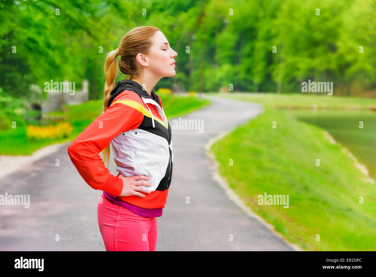 Woman relaxing after running Stock Photo - Alamy