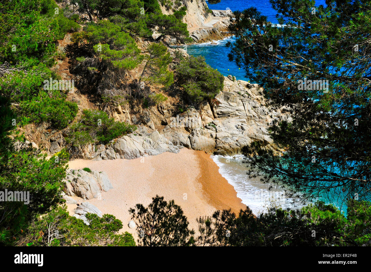 a view of the Cala den Carles beach in Tossa de Mar, Costa Brava ...