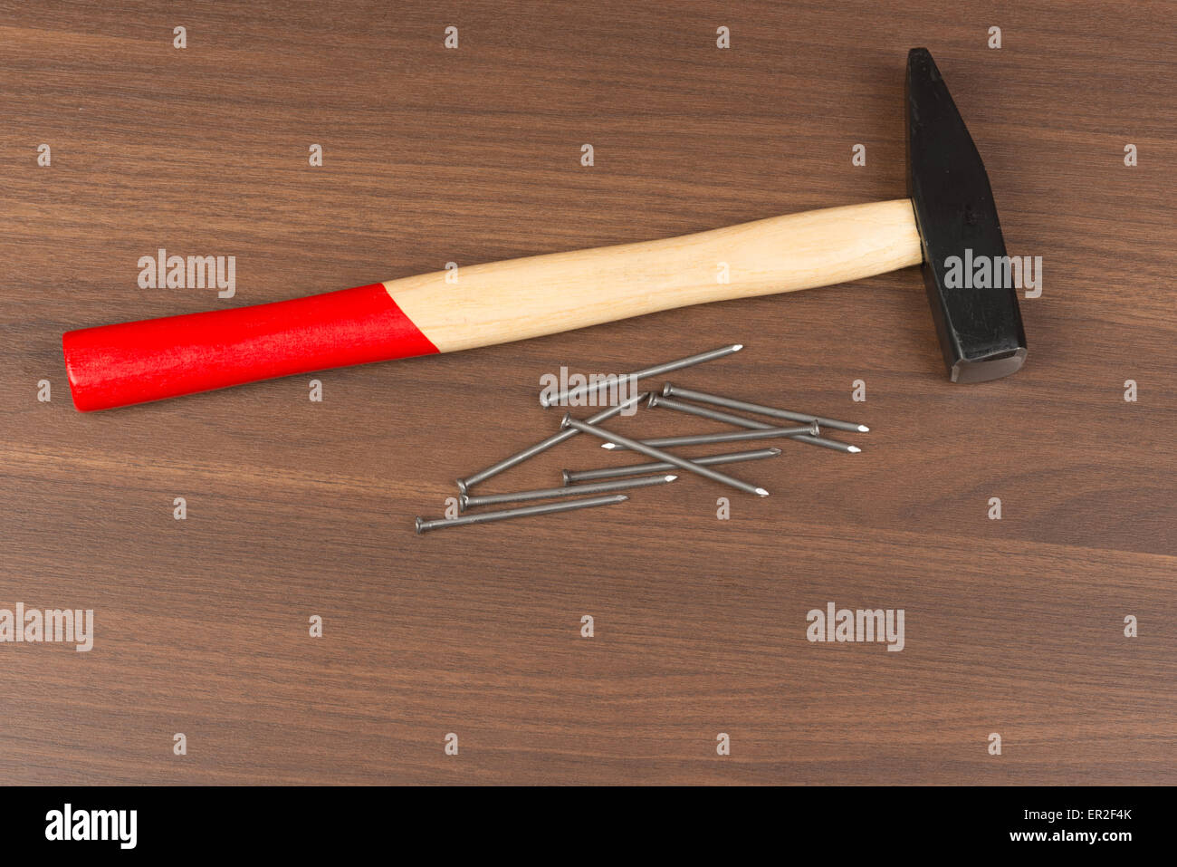 Hammer and nails on table Stock Photo - Alamy