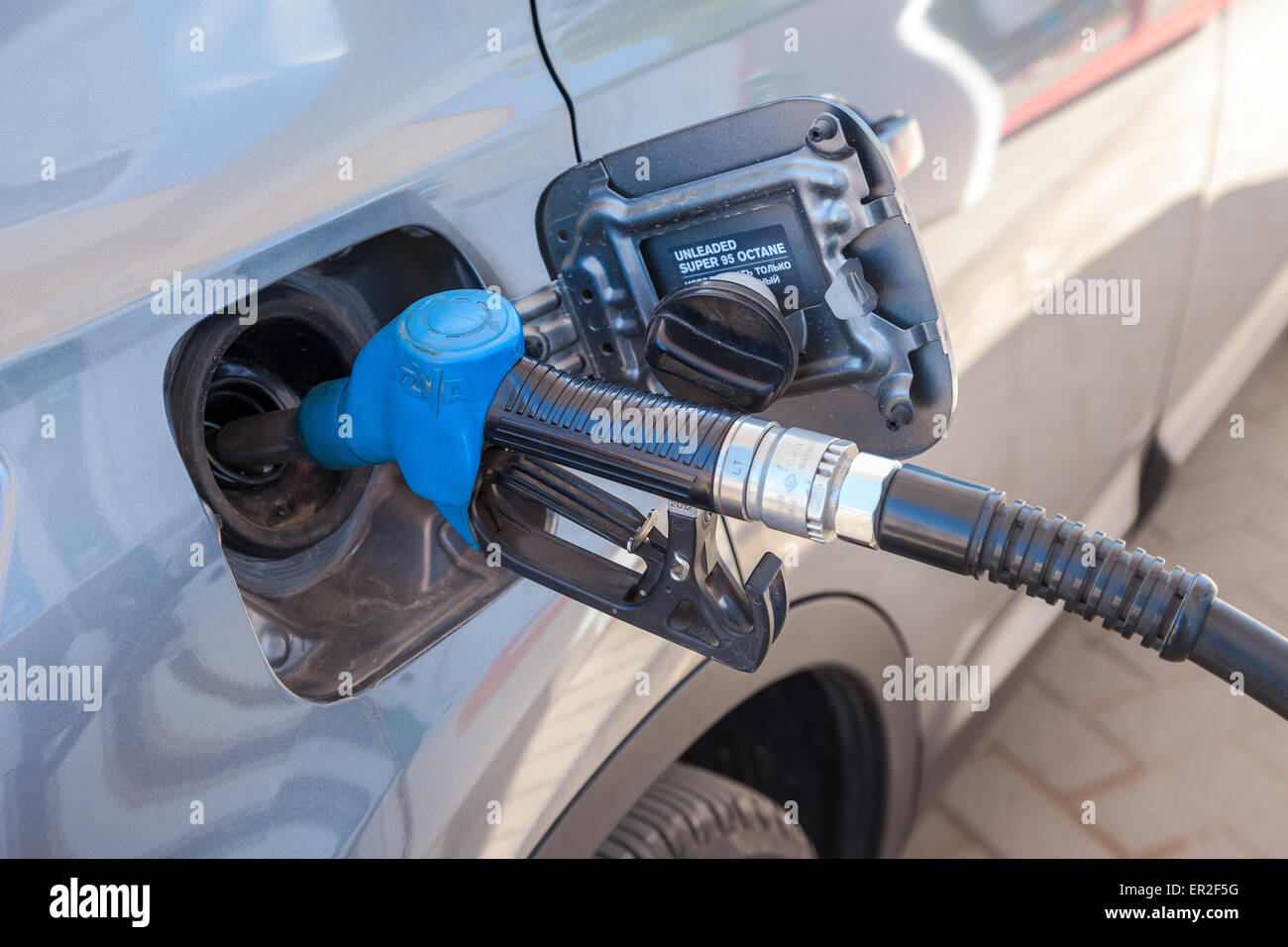 Passenger car fueled with petrol at a petrol station Stock Photo - Alamy
