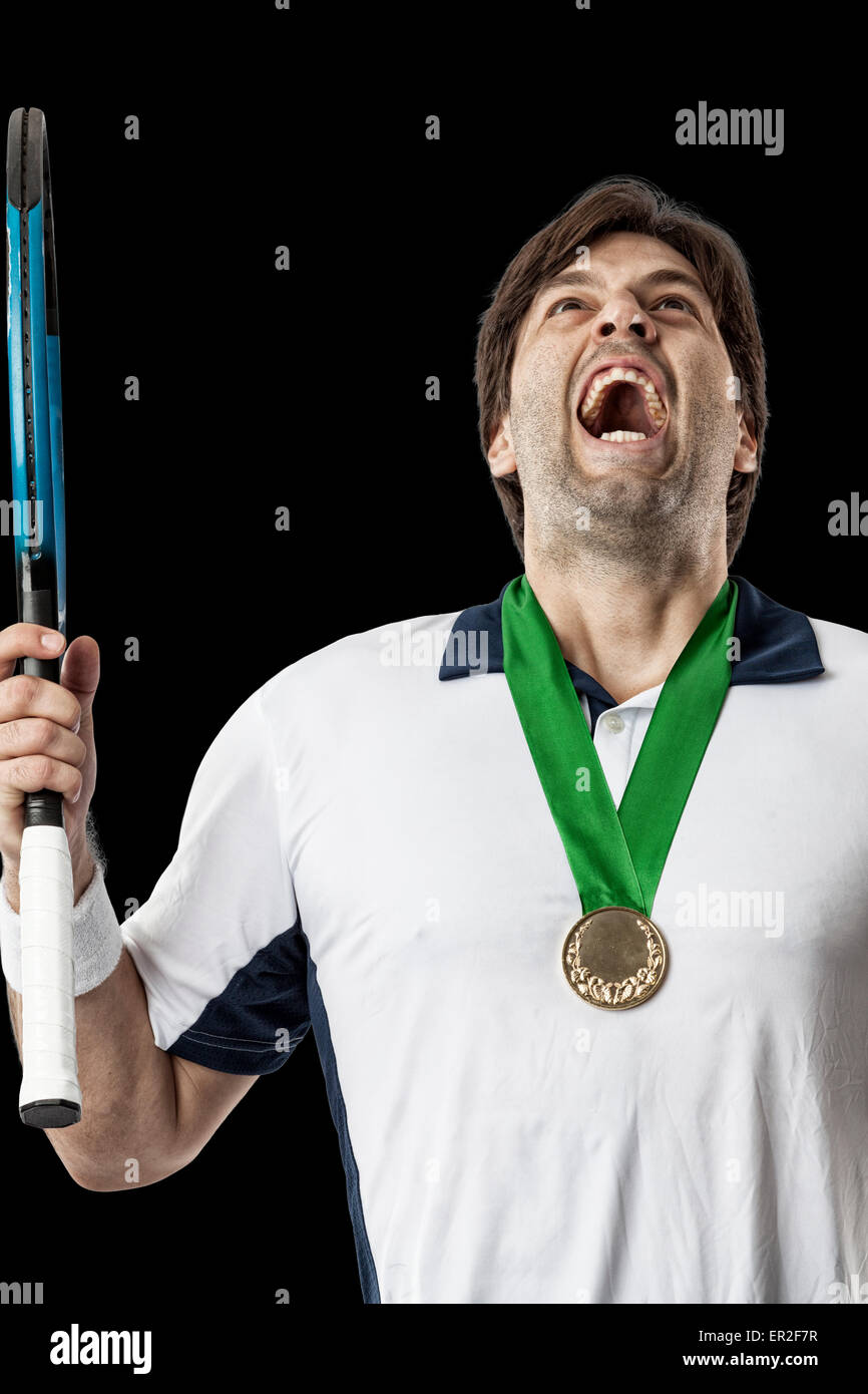 Tennis player celebrating with a gold medal, on a black background ...