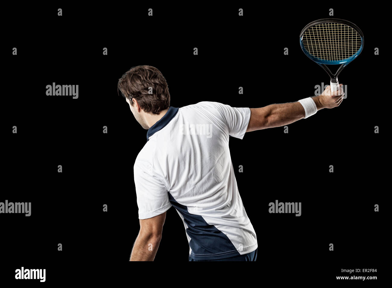 Tennis player playing on a black background Stock Photo - Alamy