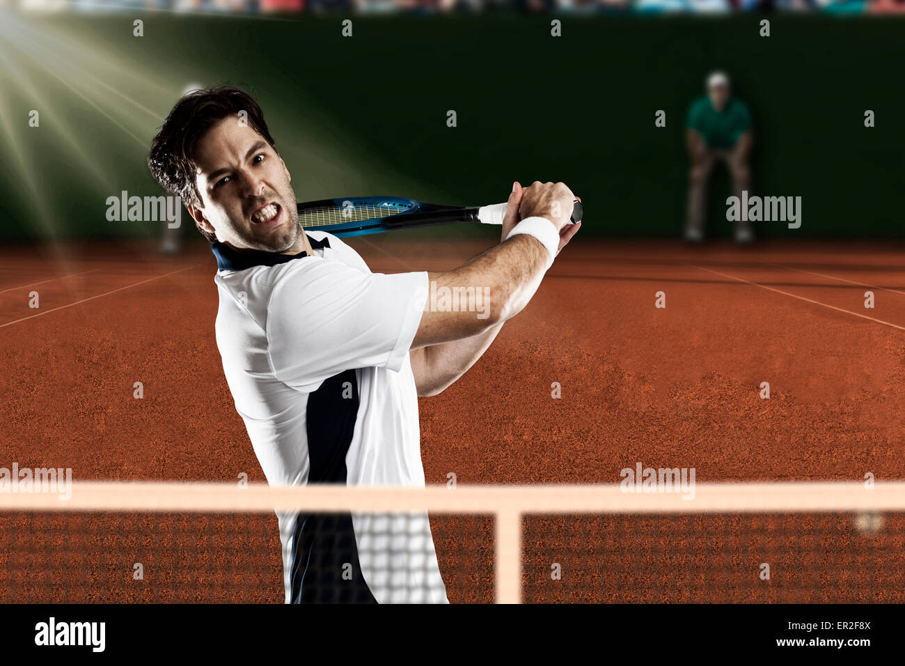 Tennis player playing on a clay tennis court Stock Photo - Alamy