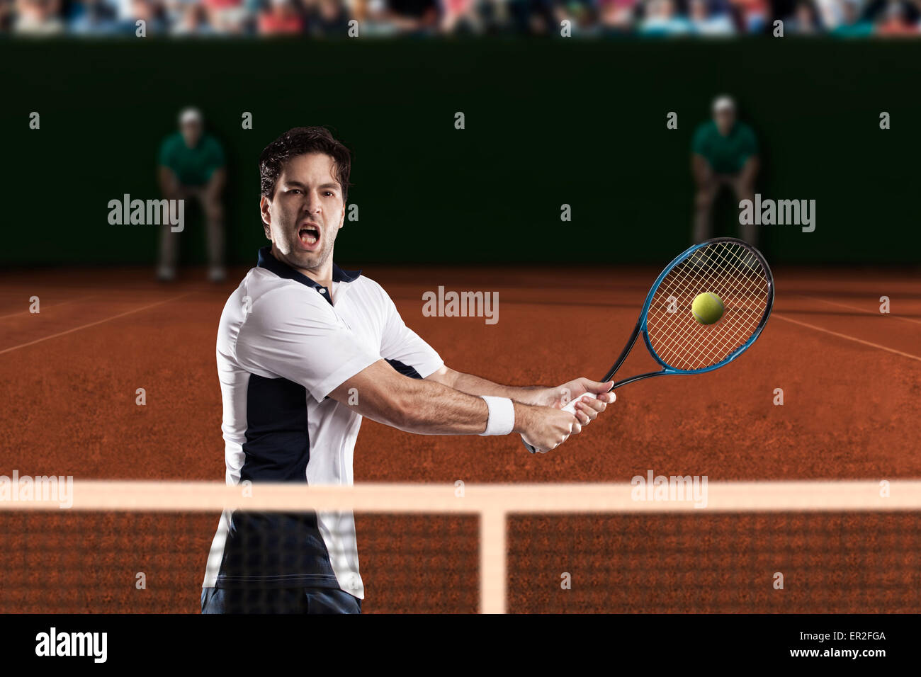 Tennis player playing on a clay tennis court Stock Photo - Alamy
