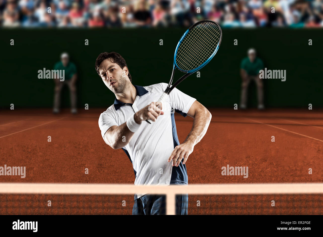 Tennis player playing on a clay tennis court Stock Photo - Alamy