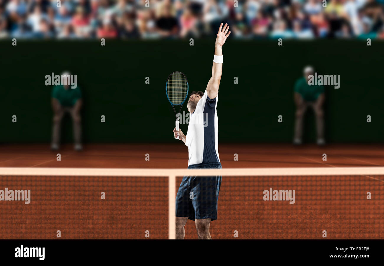 Tennis player playing on a clay tennis court Stock Photo - Alamy