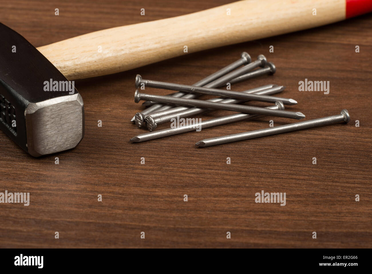Hammer and nails on table Stock Photo - Alamy