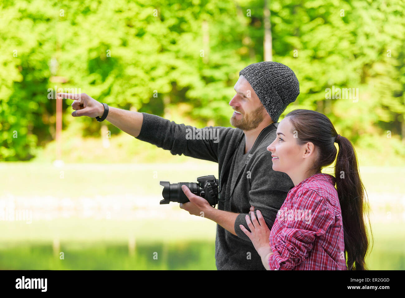 Happy couple tourists in nature Stock Photo - Alamy