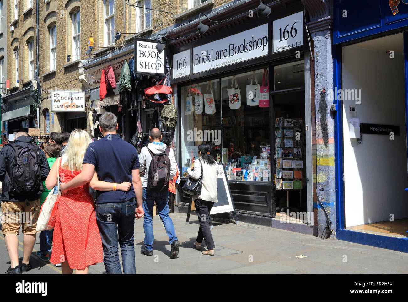 Shops on Brick Lane, in the middle of the famous Sunday market, in east ...
