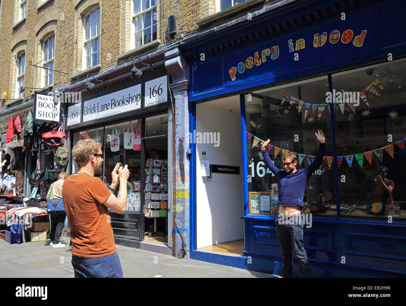 Shops on Brick Lane, in the middle of the famous Sunday market, in east ...