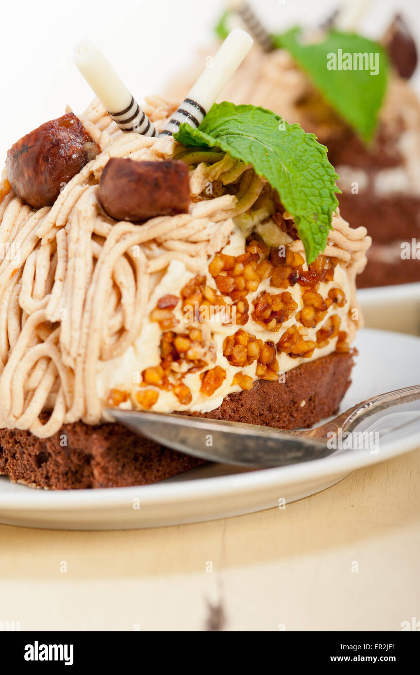 fresh baked chestnut cream cake dessert over rustic white wood table ...