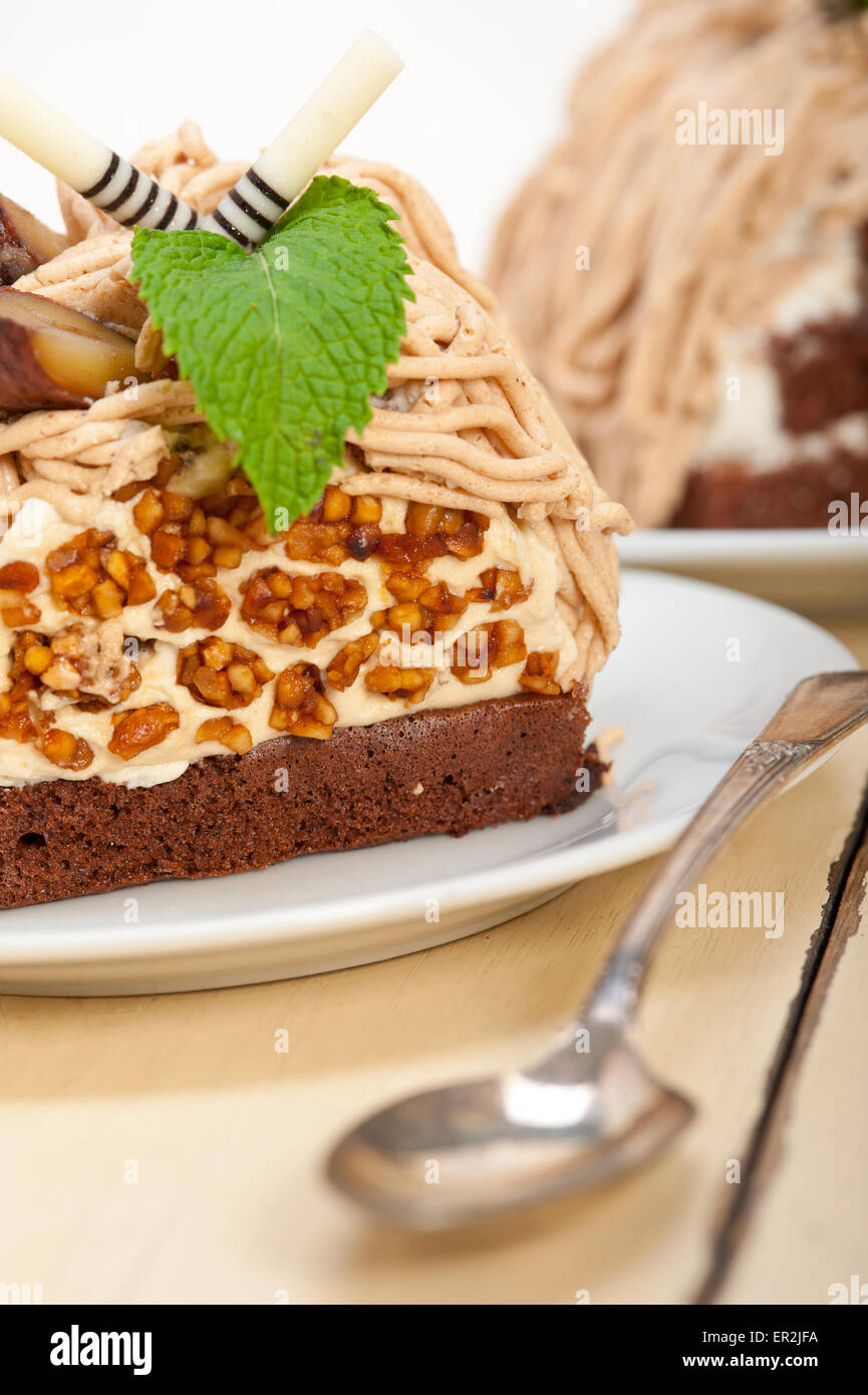 fresh baked chestnut cream cake dessert over rustic white wood table ...