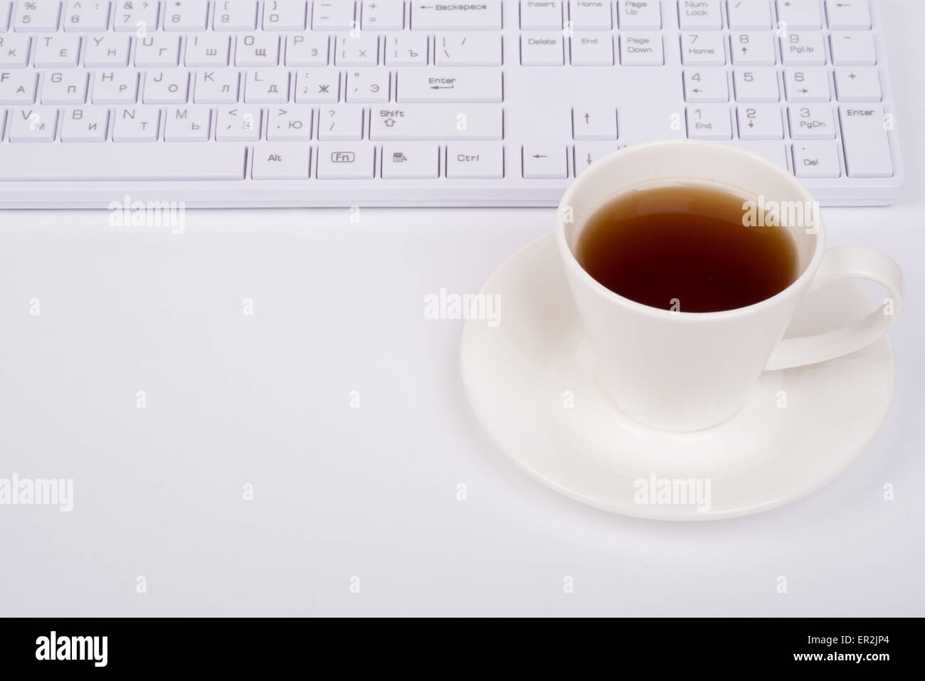 White keyboard and coffee Stock Photo - Alamy