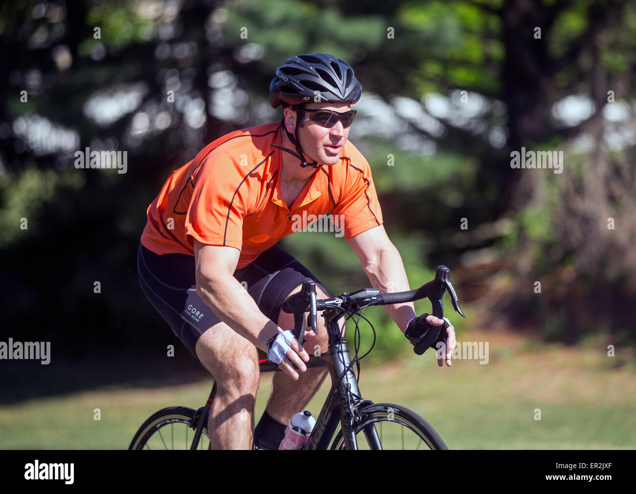 Man riding a road bike on a paved roadway Stock Photo - Alamy