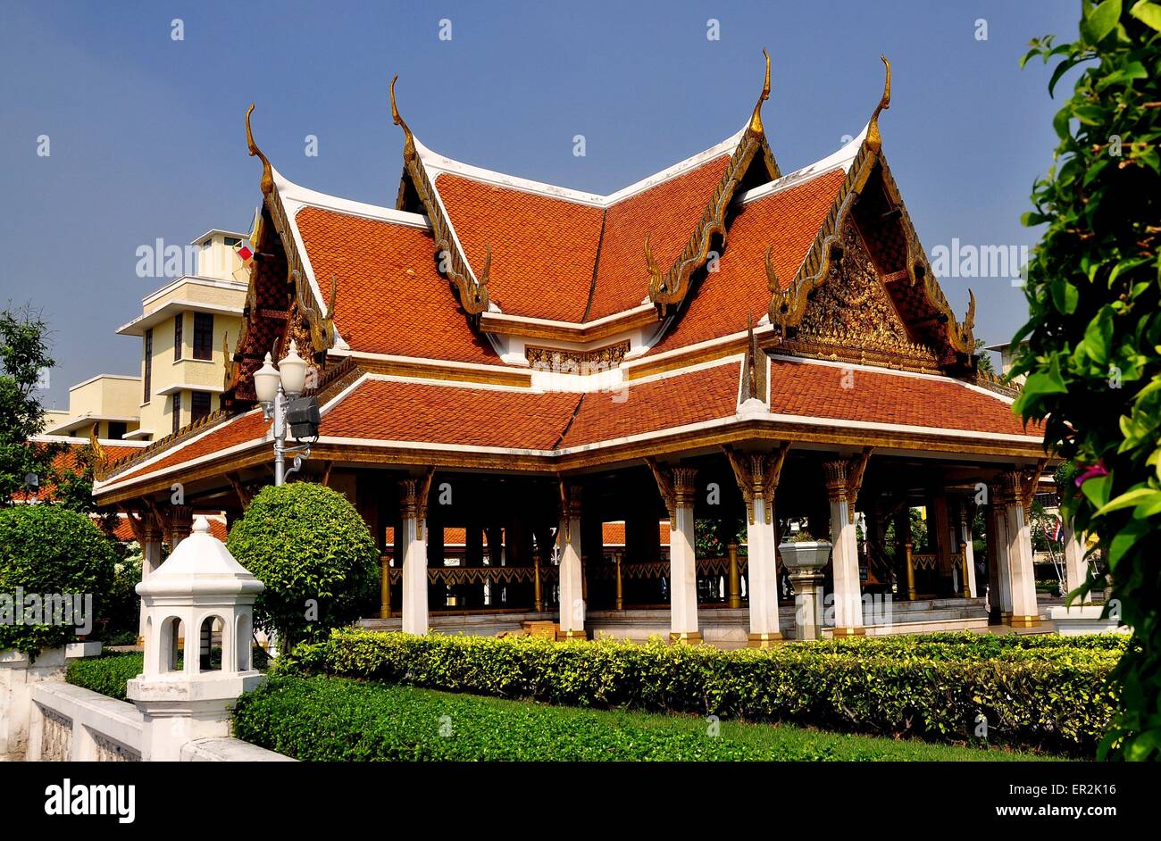 Bangkok, Thailand: An open Sala with orange tiled roofs and gilded ...
