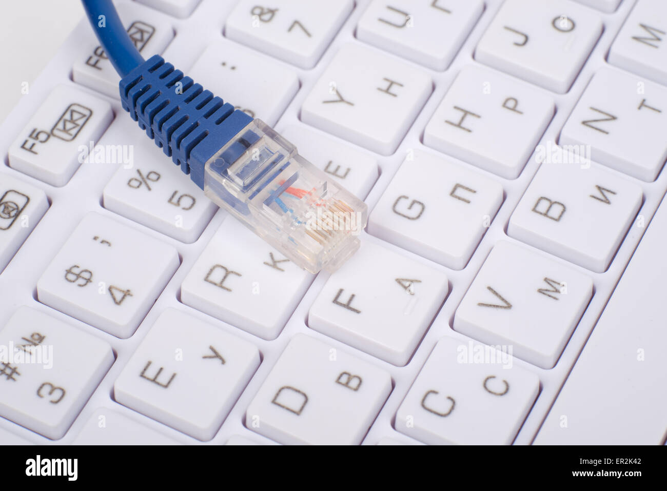 Computer cable on keyboard Stock Photo - Alamy
