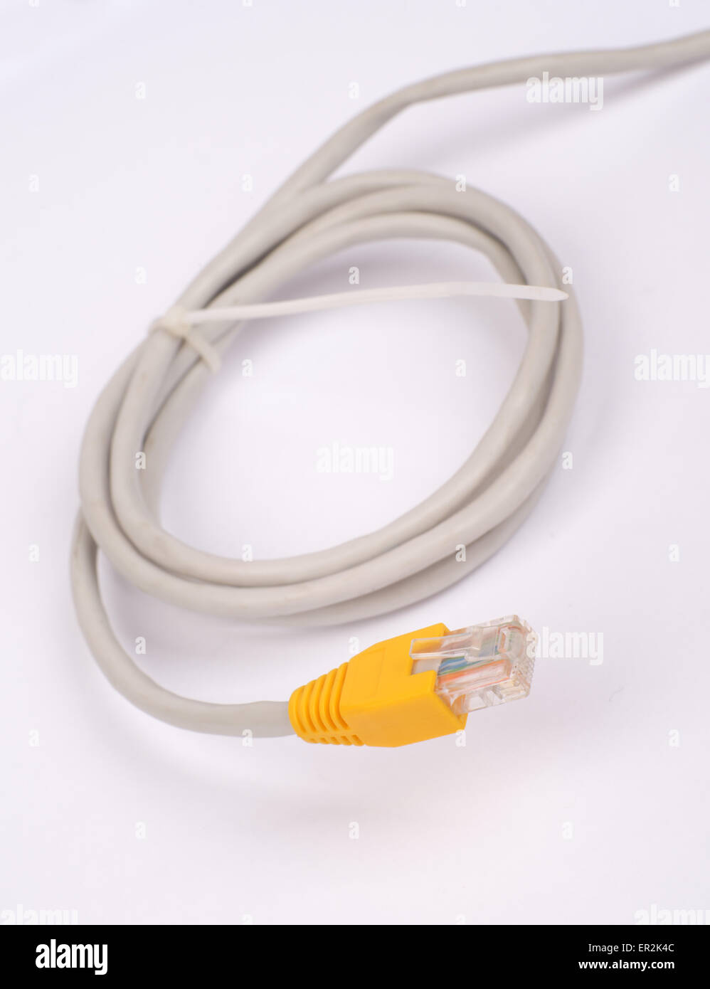 Twisted yellow computer cable Stock Photo - Alamy