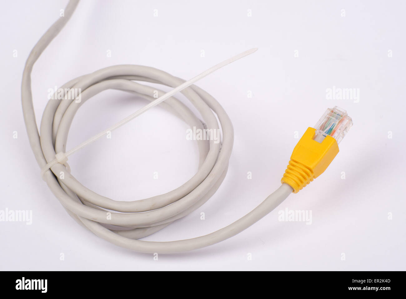 Twisted yellow computer cable Stock Photo - Alamy
