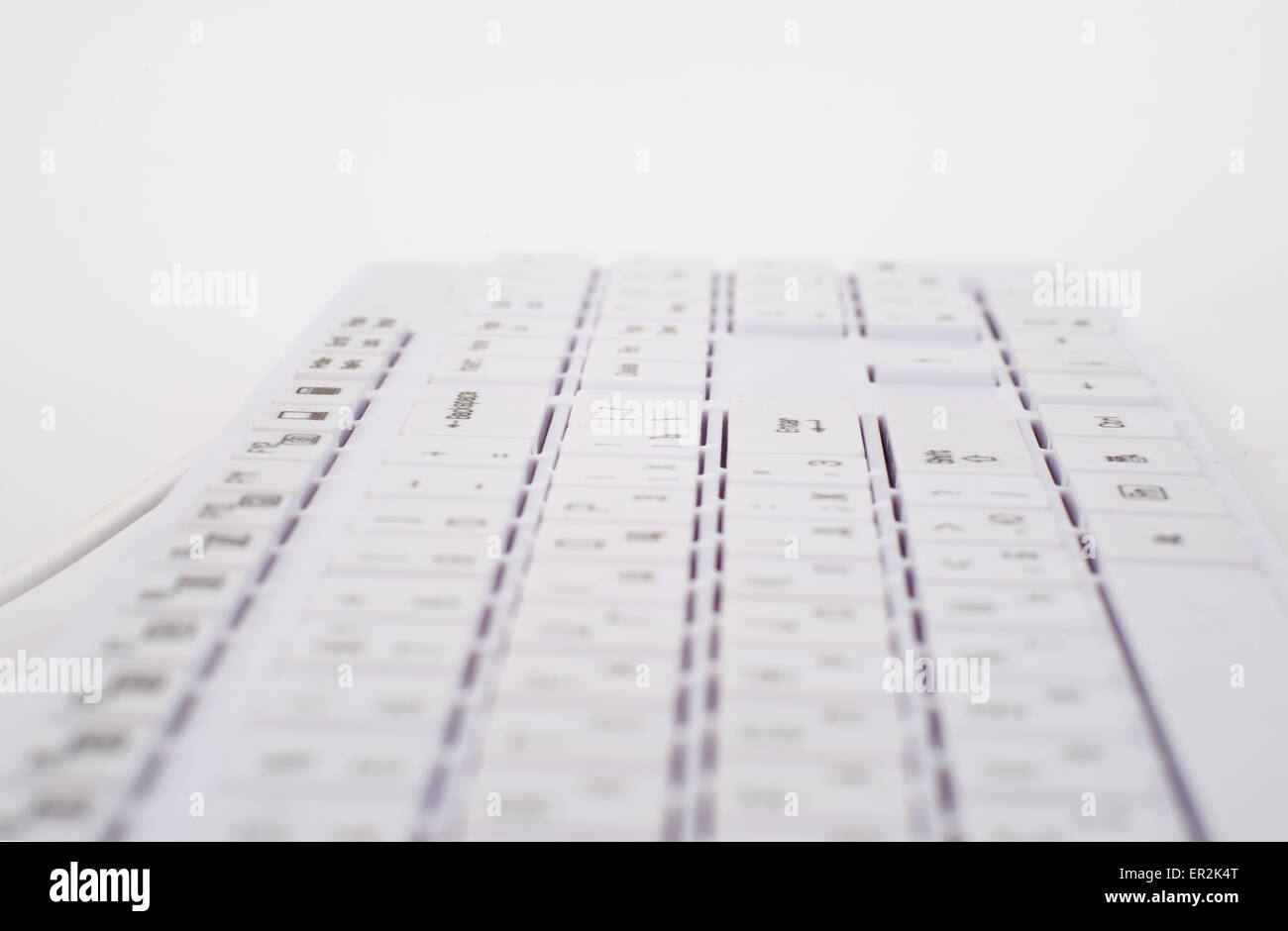 White computer keyboard with wire Stock Photo - Alamy