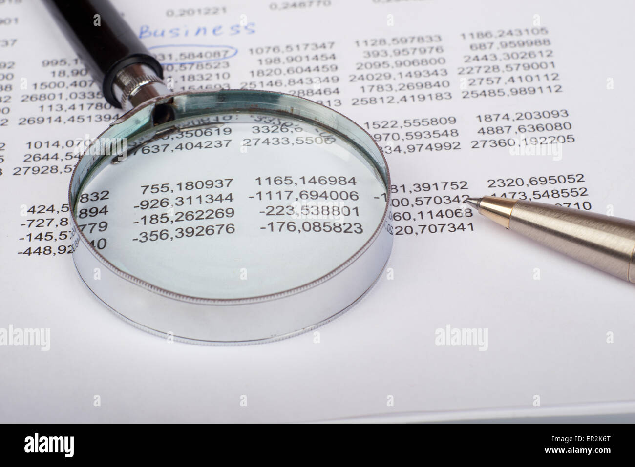 Hand glass on papers Stock Photo - Alamy