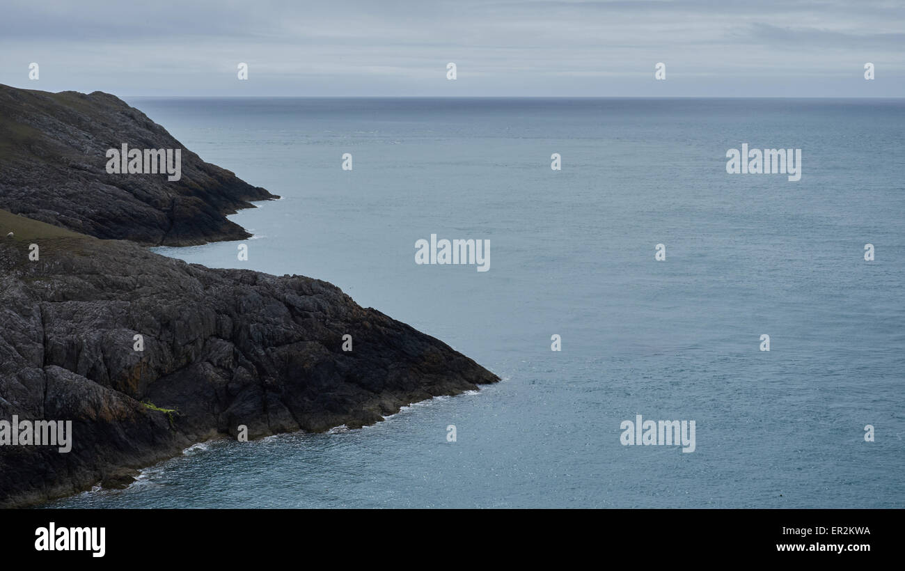 Cliffs descending into the sea of Bardsey Sound at the western most tip ...