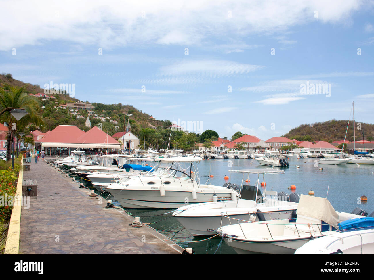 Boats moored along rue du Bord de Mer in the Gustavia harbor, St. Barts ...