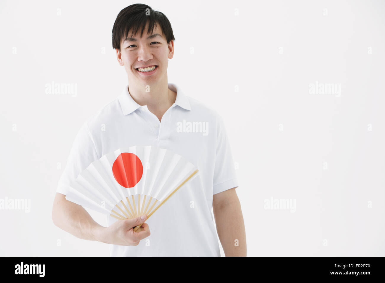 Businessman with paper fan Stock Photo - Alamy