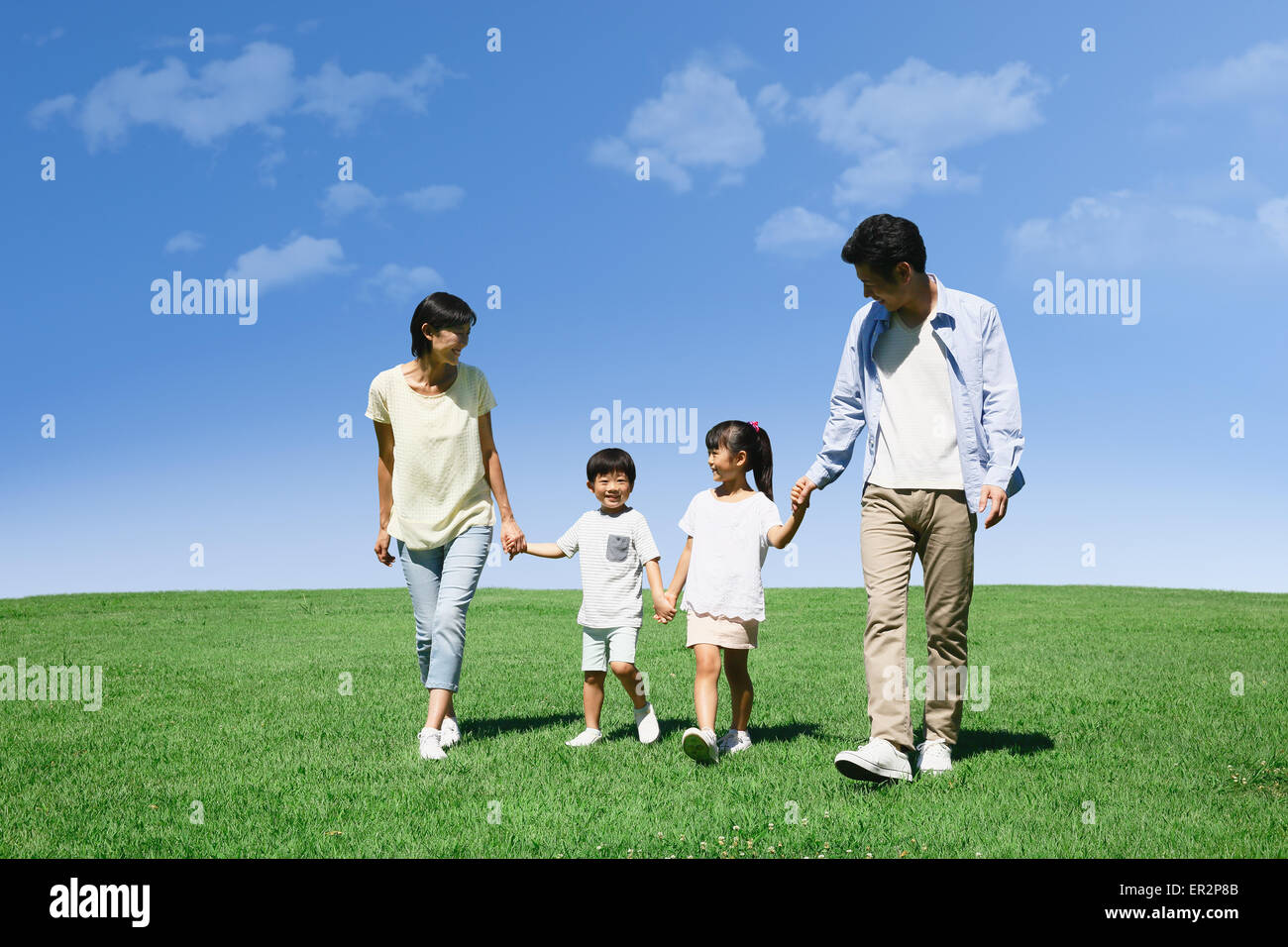Happy Japanese family in a city park Stock Photo - Alamy