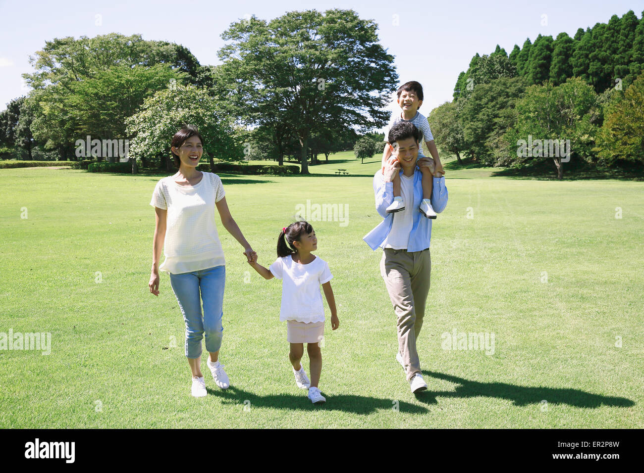 Happy Japanese family in a city park Stock Photo - Alamy