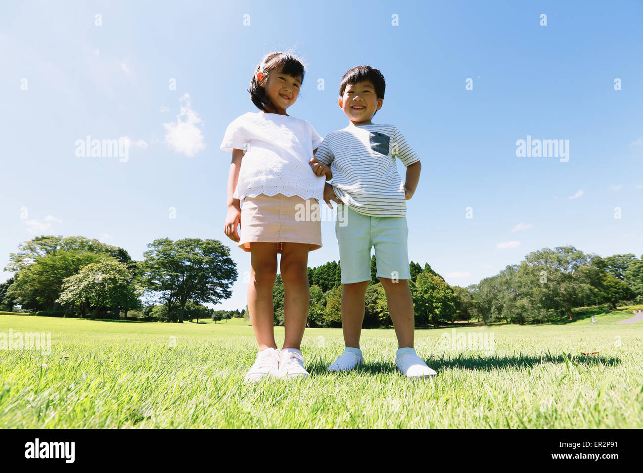 Happy Japanese kids in a city park Stock Photo - Alamy