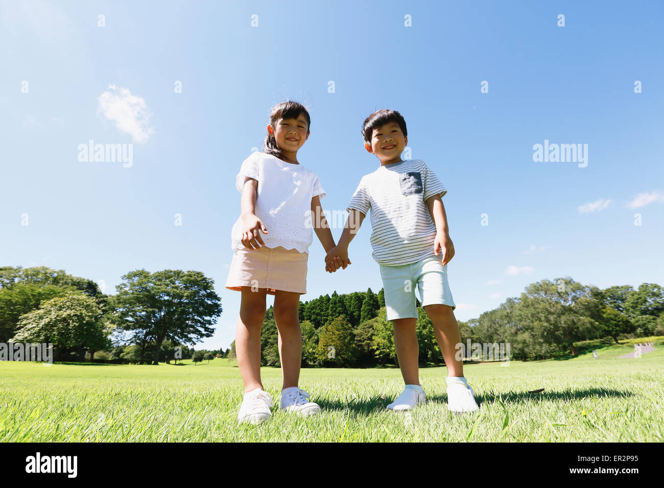 Happy Japanese kids in a city park Stock Photo - Alamy
