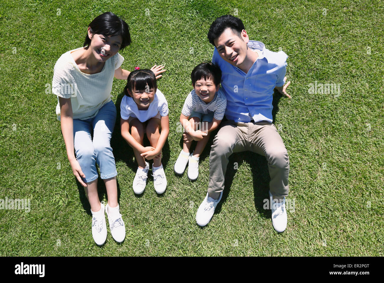 Happy Japanese family in a city park Stock Photo - Alamy