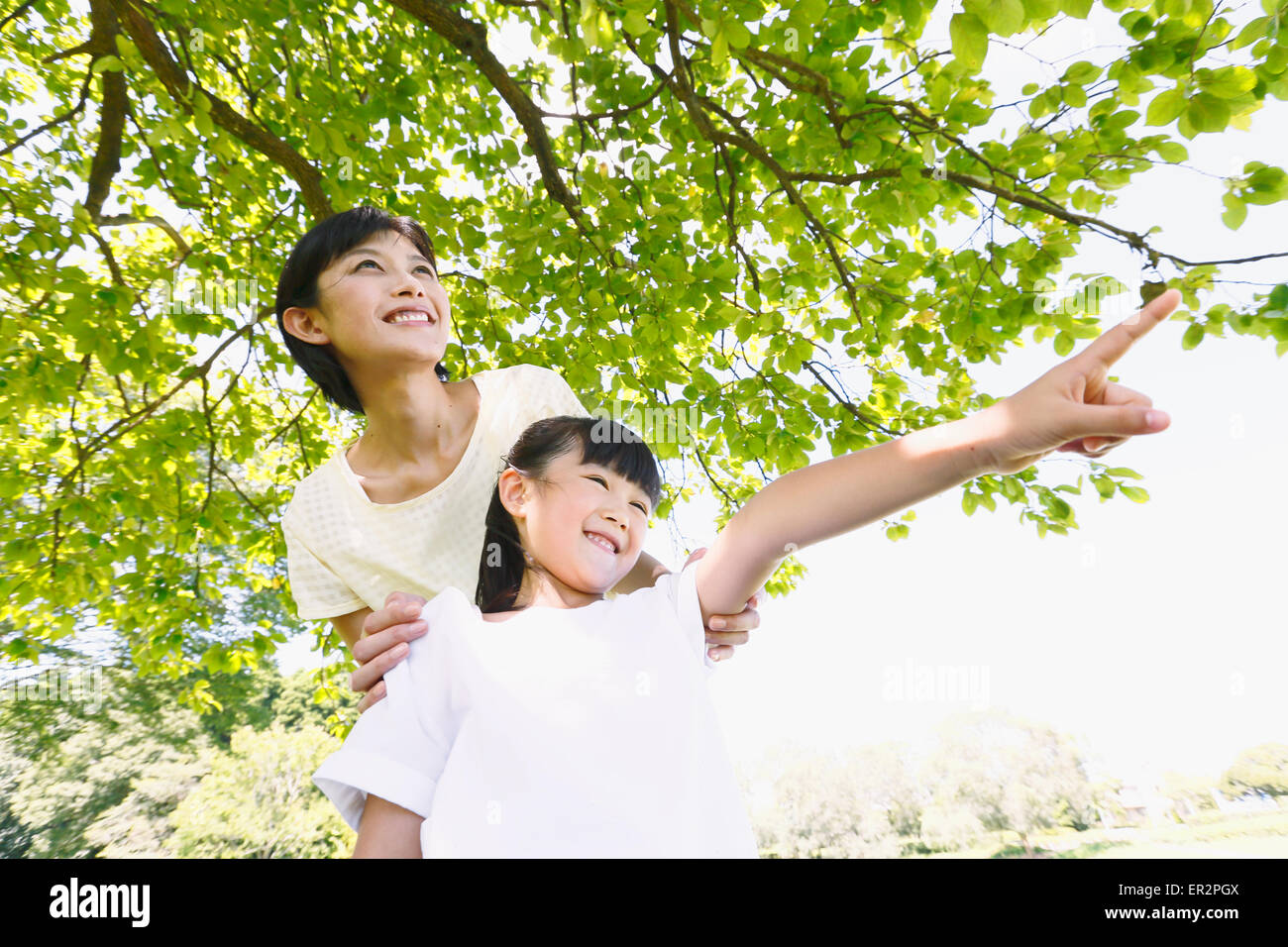 Japanese mother and daughter in a city park Stock Photo - Alamy