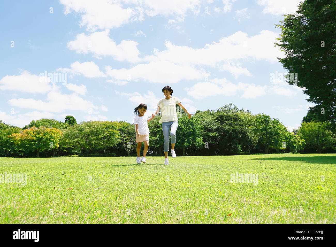 Japanese mother and daughter in a city park Stock Photo - Alamy