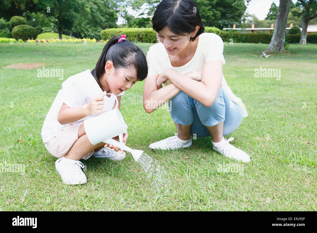 Japanese mother and daughter in a city park Stock Photo - Alamy