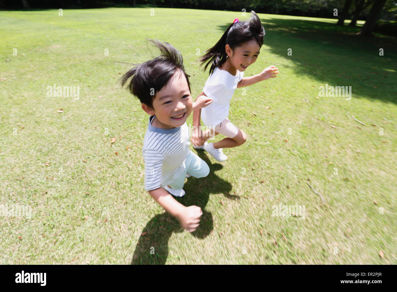 Happy Japanese kids in a city park Stock Photo - Alamy
