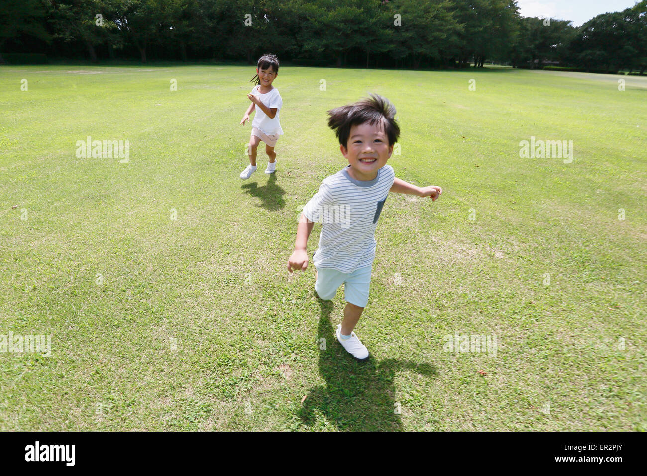 Happy Japanese kids in a city park Stock Photo - Alamy