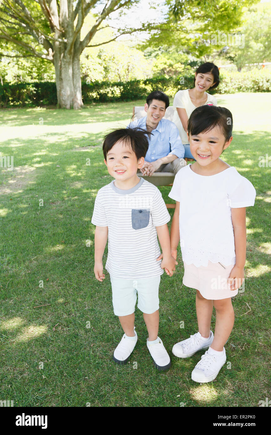 Happy Japanese family in a city park Stock Photo - Alamy