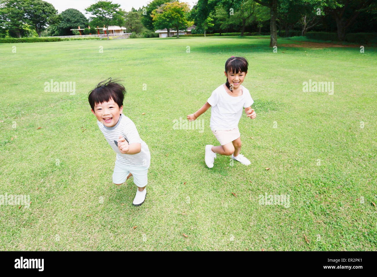 Happy Japanese kids in a city park Stock Photo - Alamy