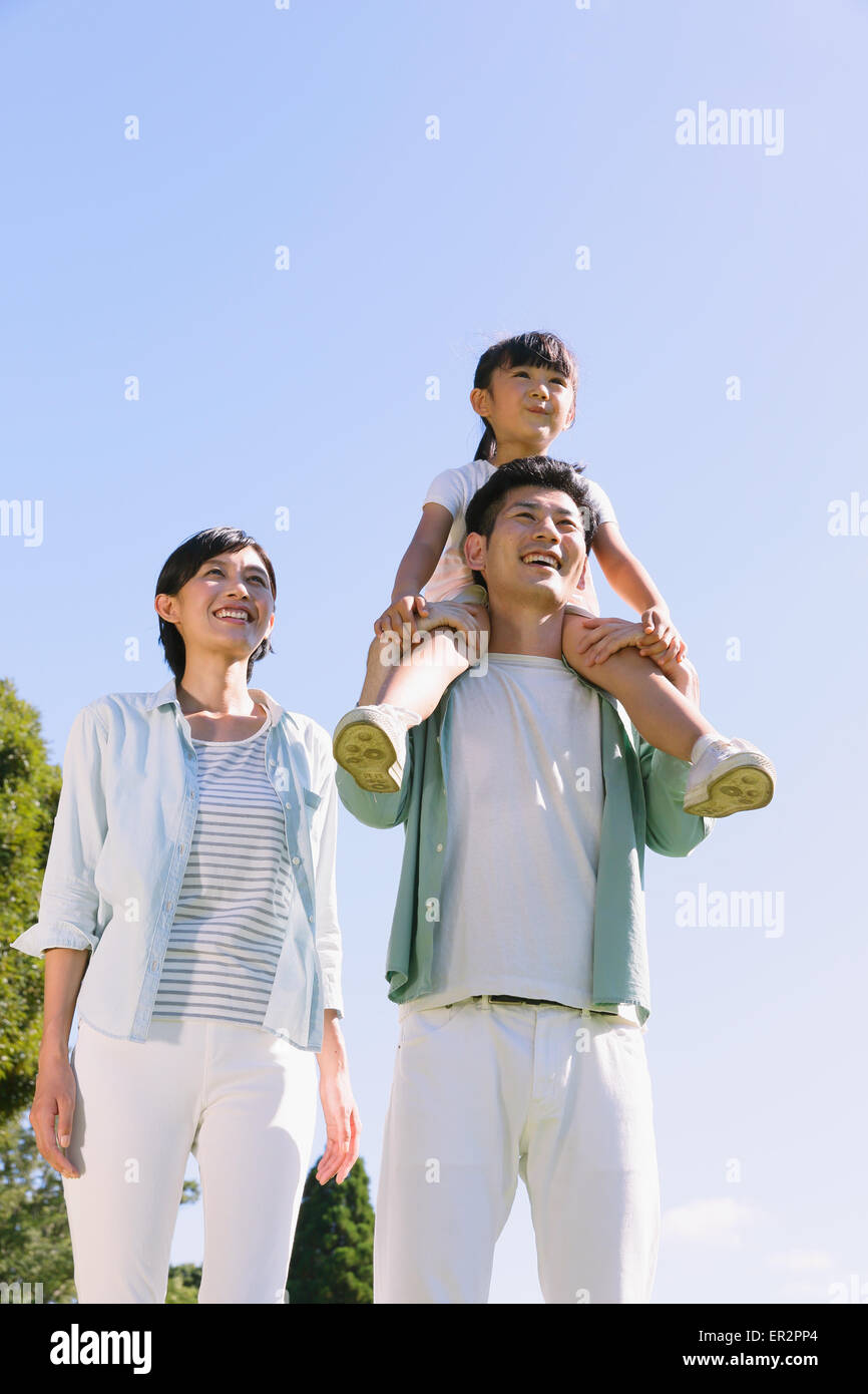 Happy Japanese family in a city park Stock Photo - Alamy