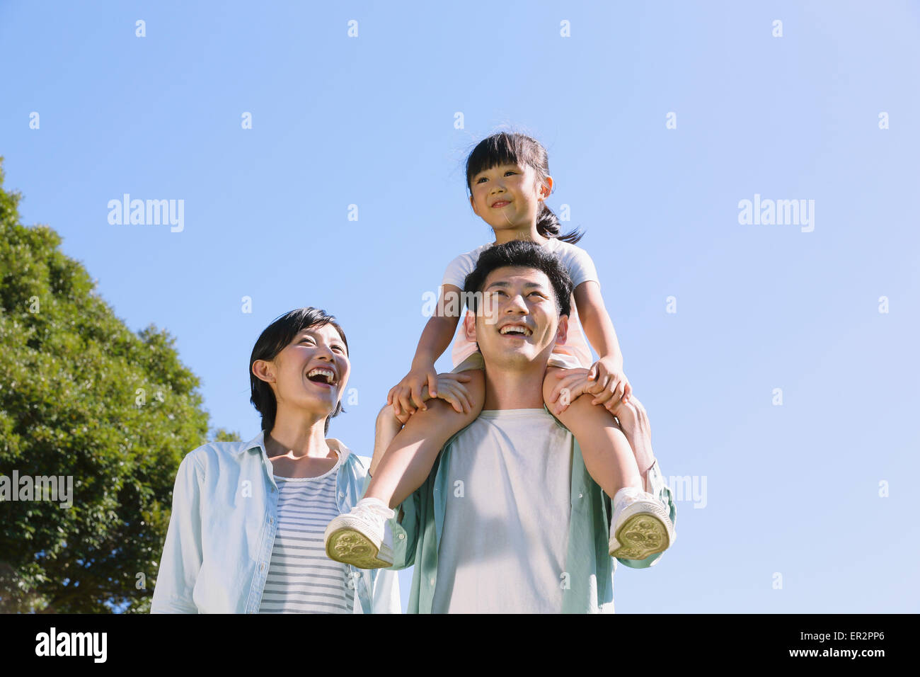 Happy Japanese family in a city park Stock Photo - Alamy